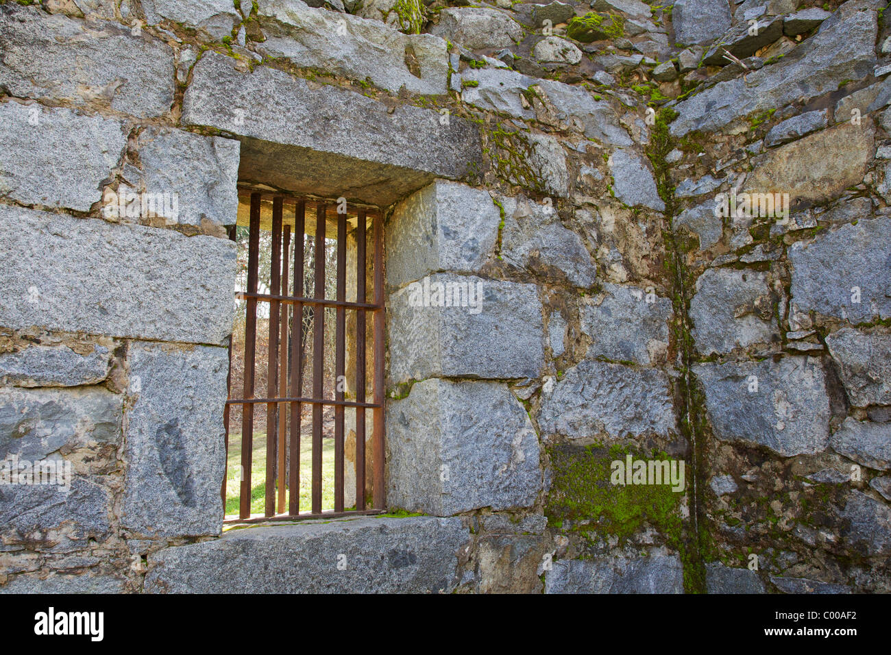 Old gold country jail cell steel barred windows Stock Photo - Alamy
