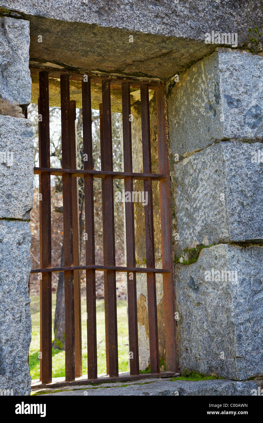 Old gold country jail cell steel barred windows Stock Photo - Alamy