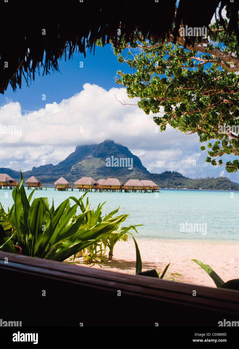 Wooden Huts In Lagoon Stock Photo - Alamy