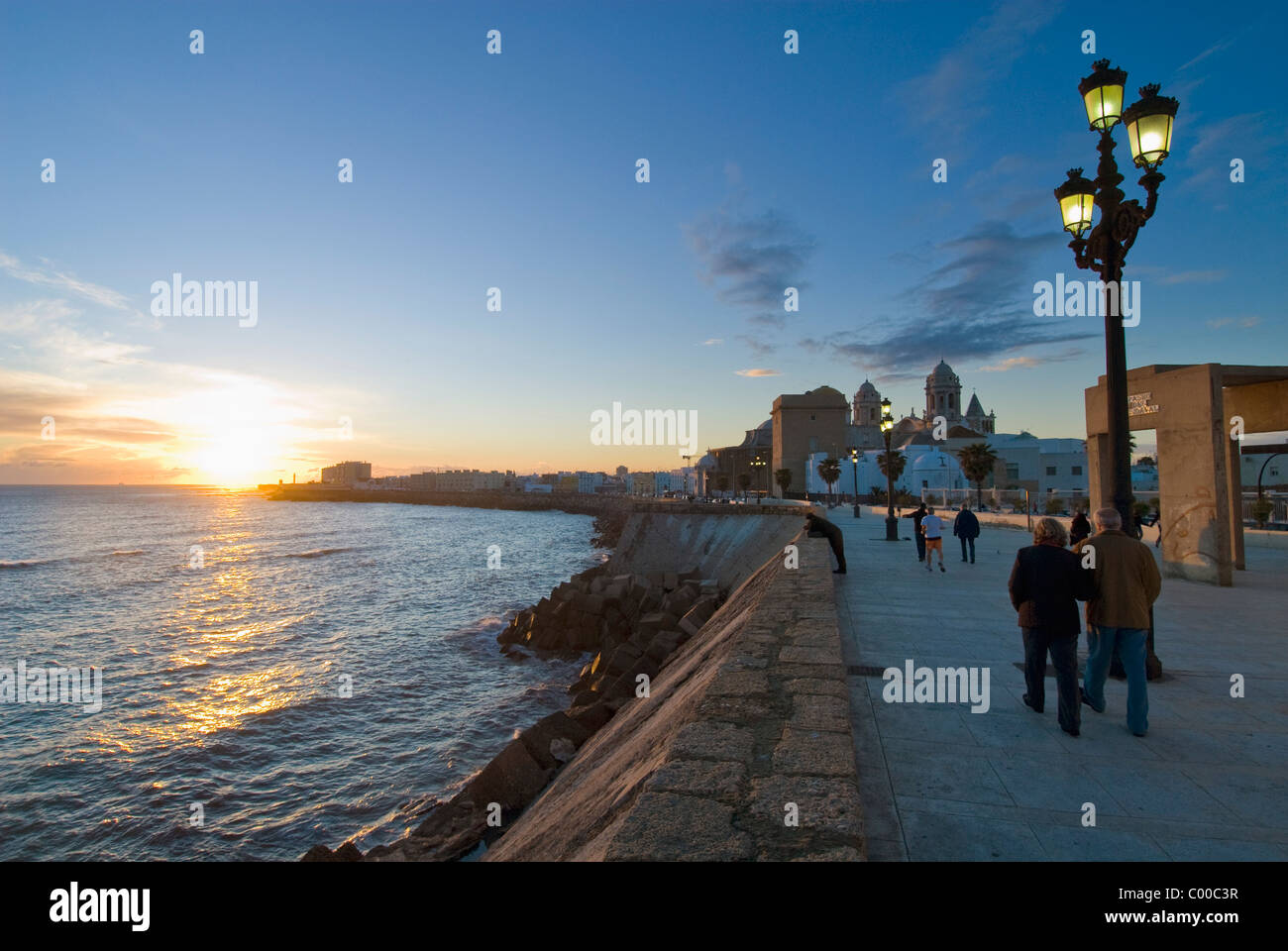 People On Promenade At Sunset Stock Photo - Alamy