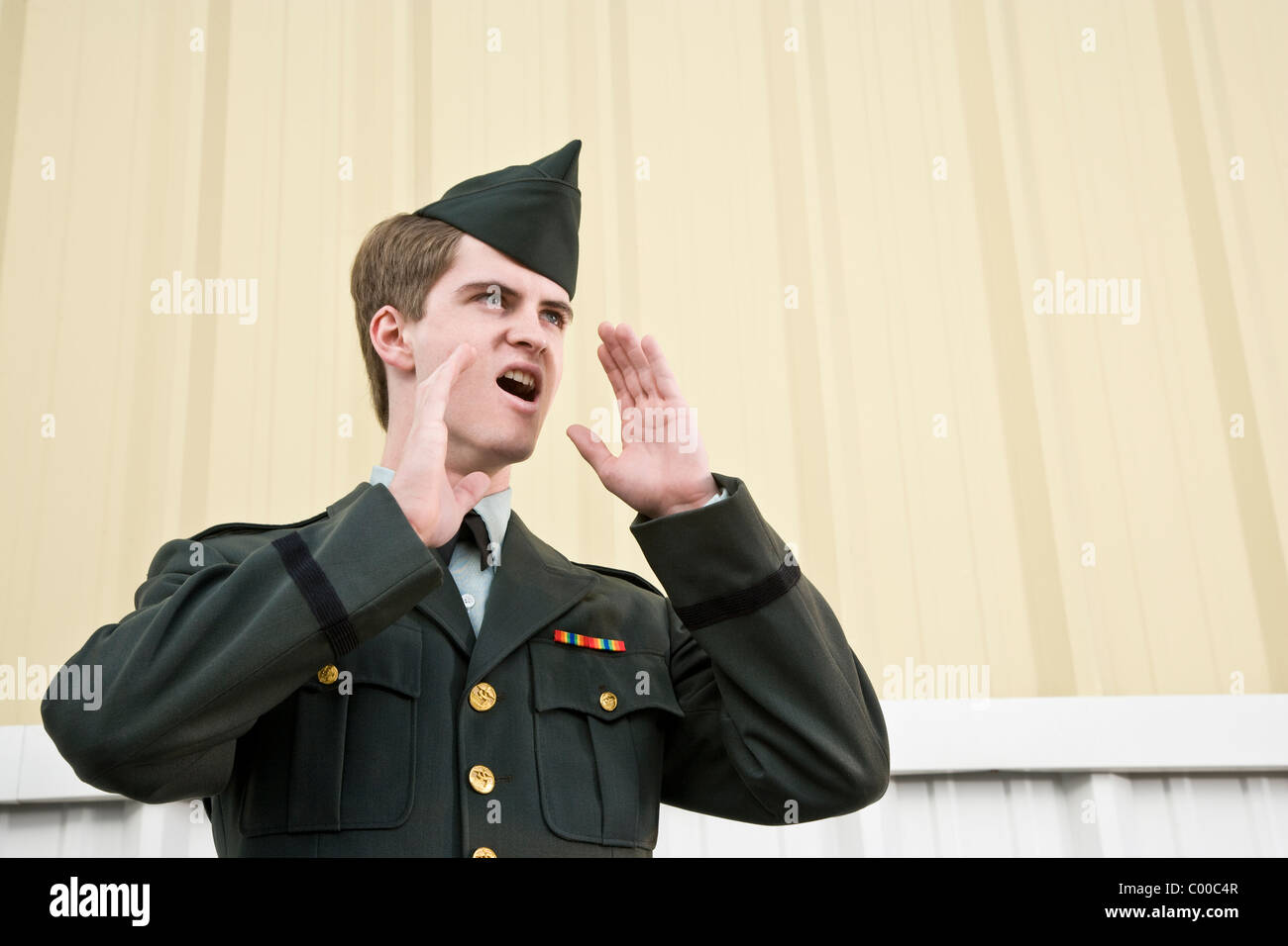 Young man in retro army uniform shouting Stock Photo - Alamy