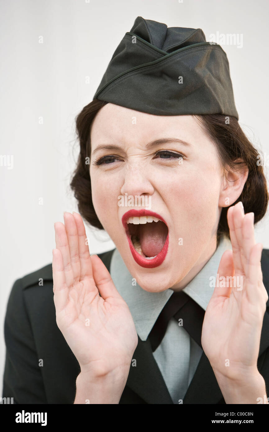 Woman in retro army uniform, shouting orders Stock Photo - Alamy