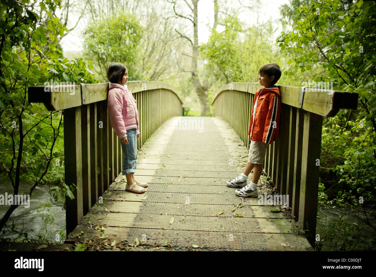 Girl facing boy hi-res stock photography and images - Alamy
