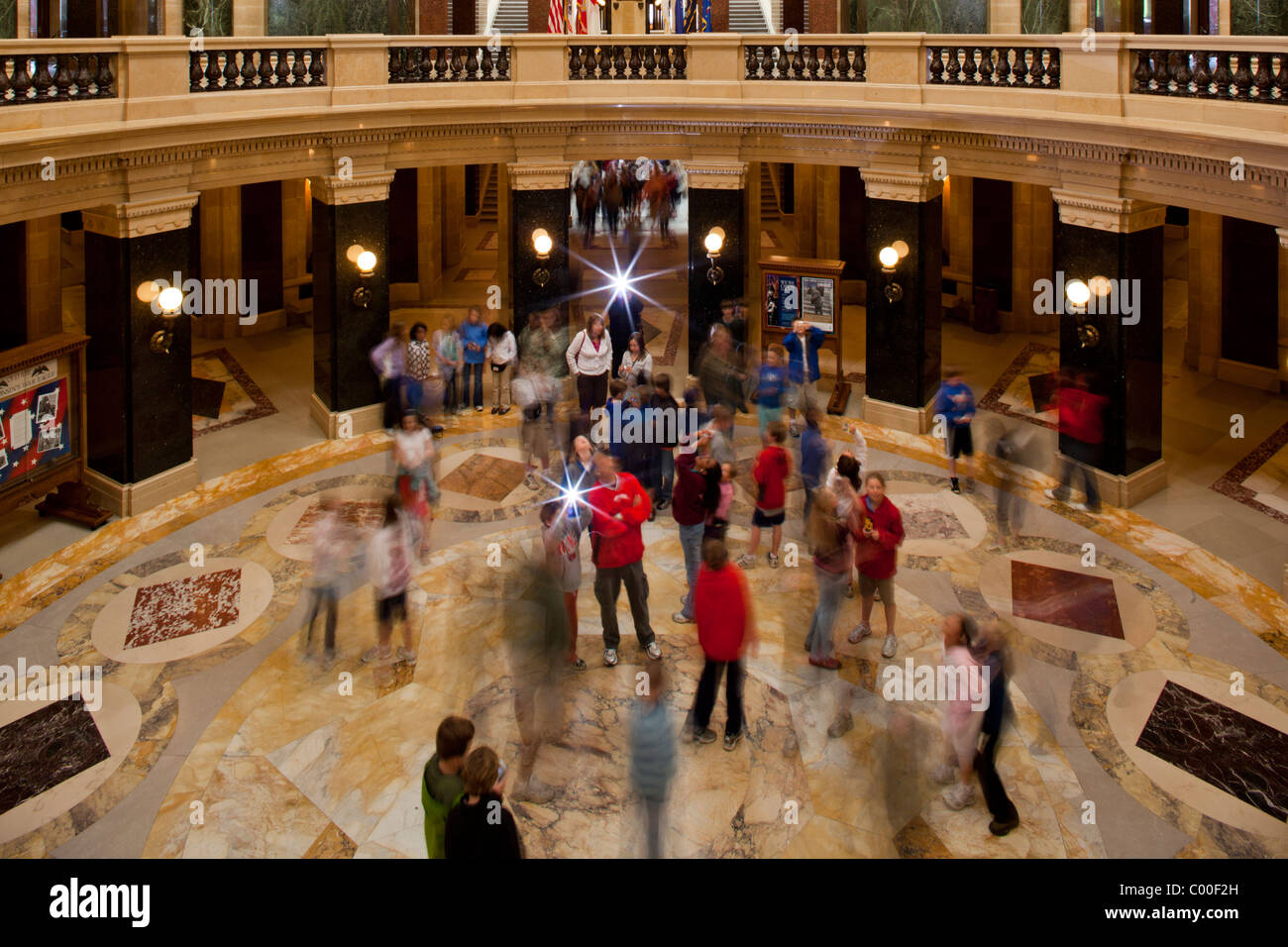 USA, Wisconsin, Madison, Visitors take flash snapshots inside massive ...
