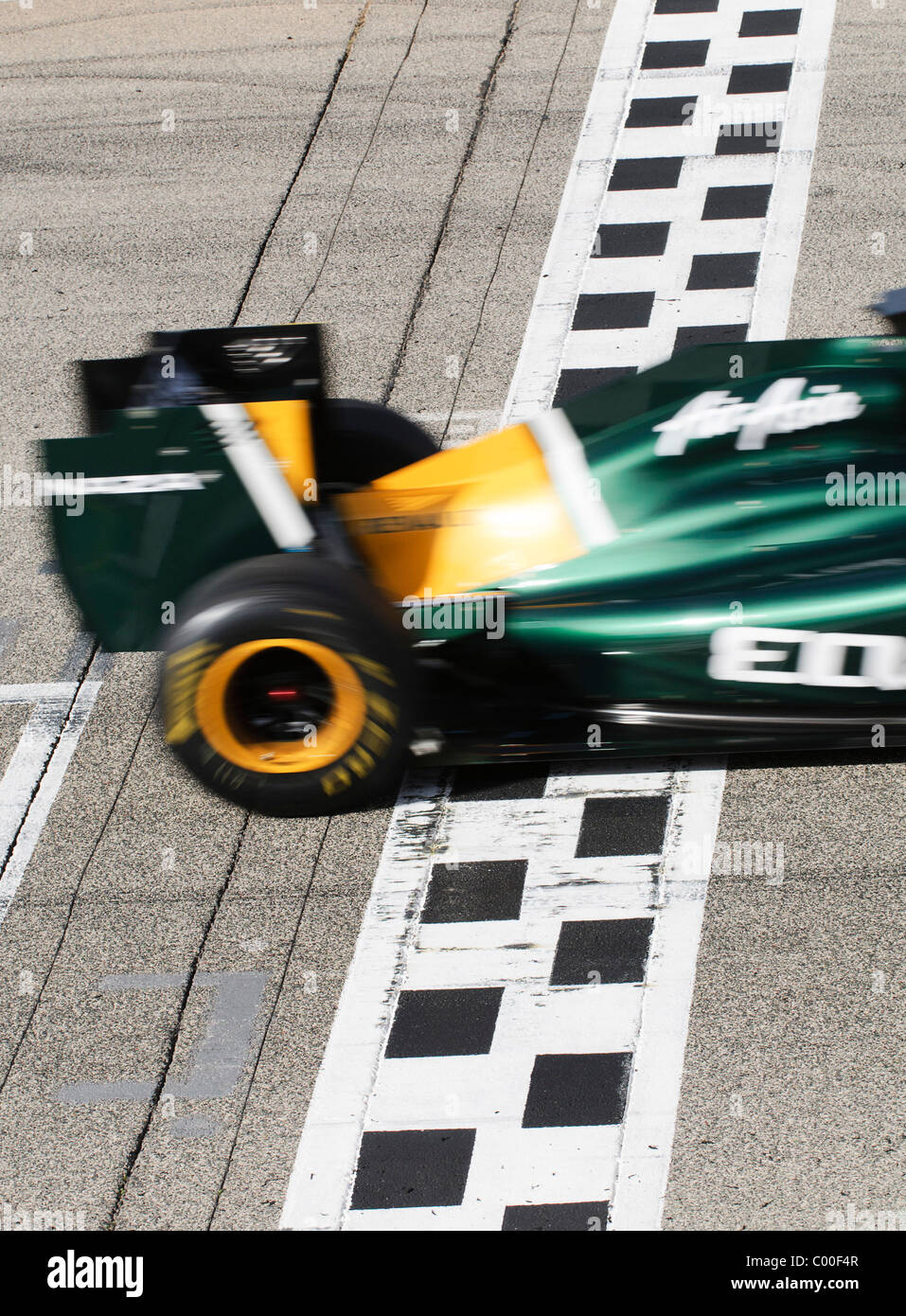 Lotus T128 Formula One race car crosses the finish line Stock Photo - Alamy