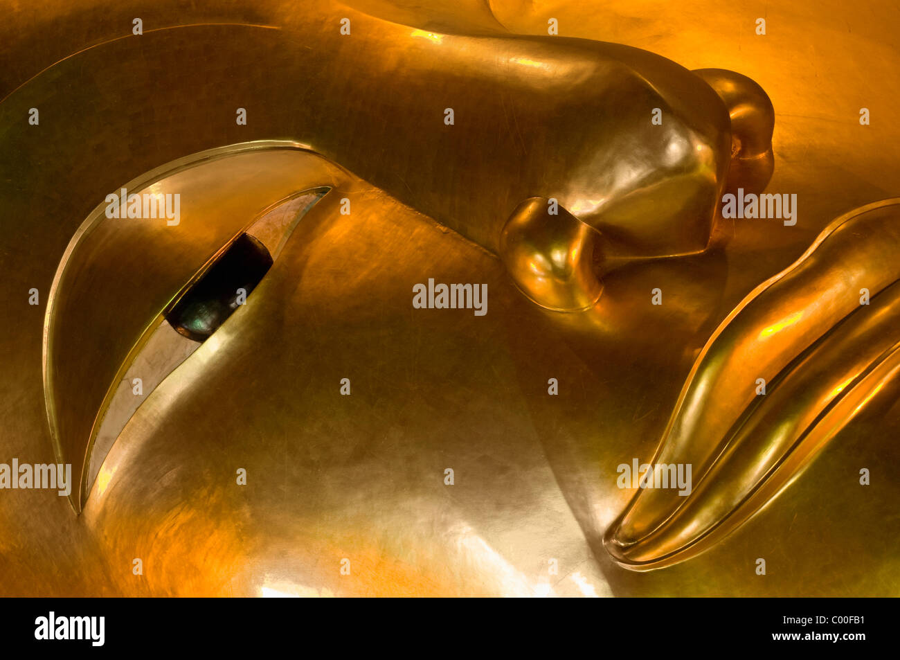 Detail of reclining Buddha statue Stock Photo - Alamy