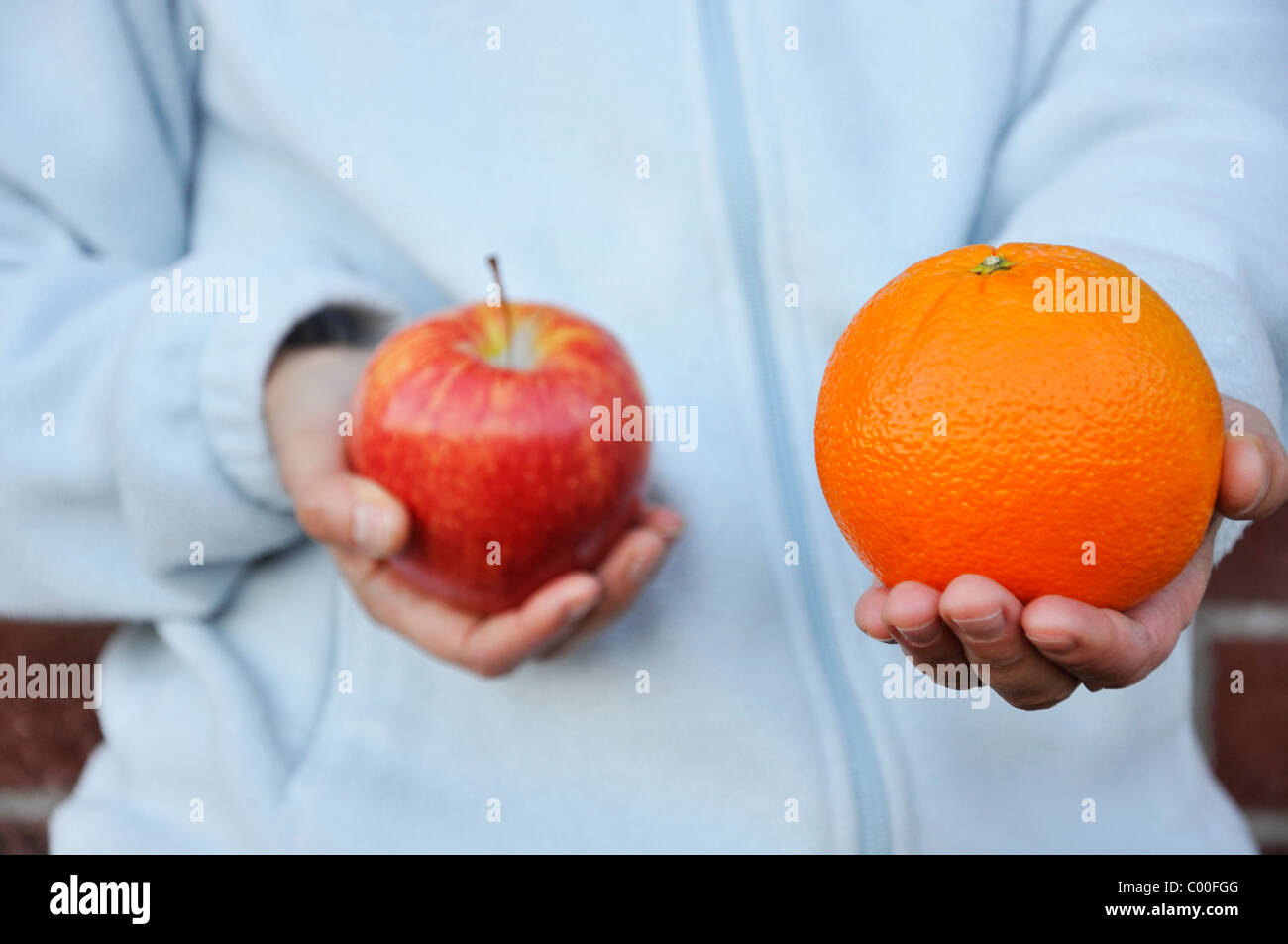 Girl compare fruits hi-res stock photography and images - Alamy