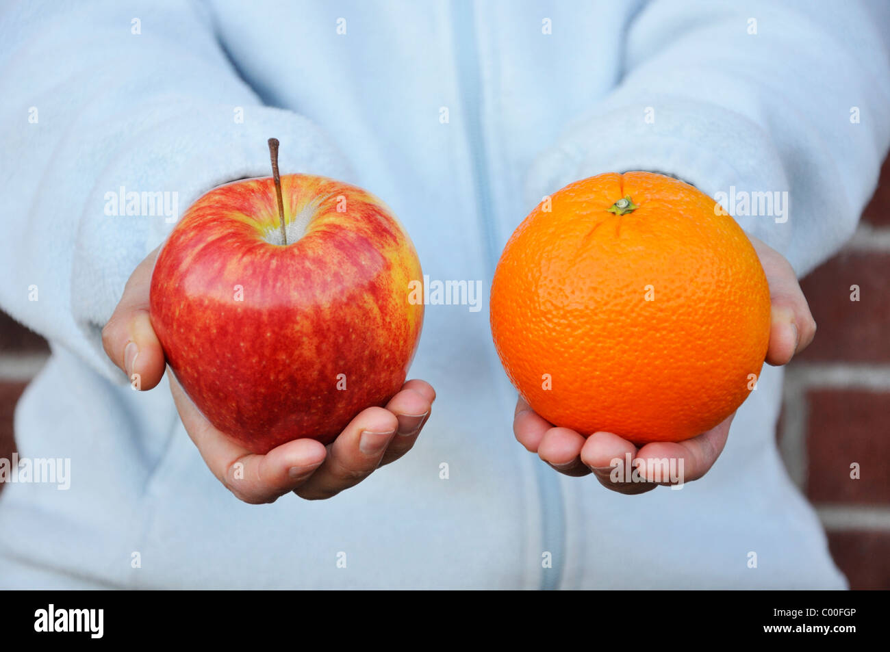 Girl compare fruits hi-res stock photography and images - Alamy