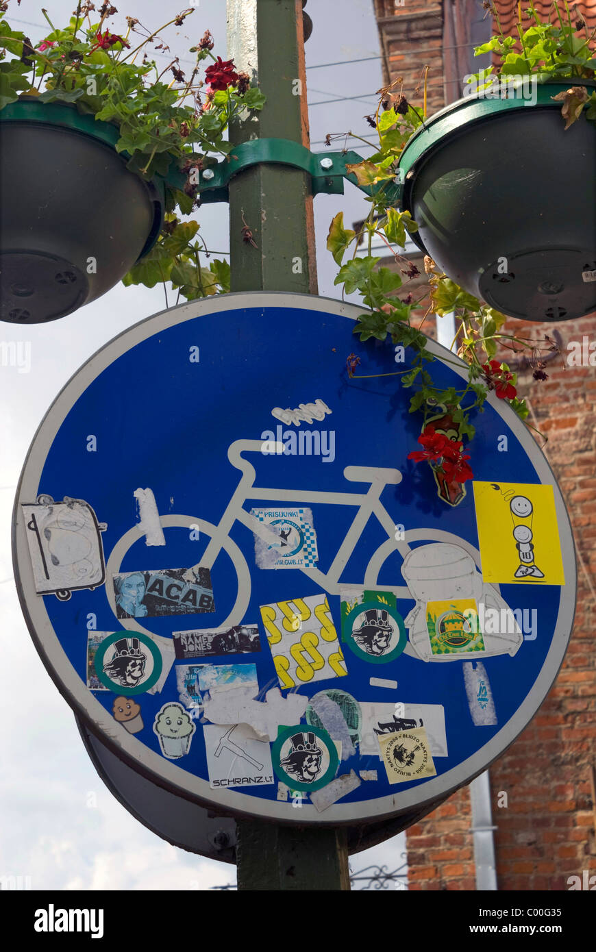 A cycle route sign covered in stickers Stock Photo - Alamy