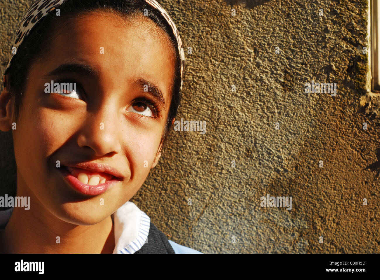 Algeria, Algiers, close-up portrait of a smiling happy girl wearing a ...