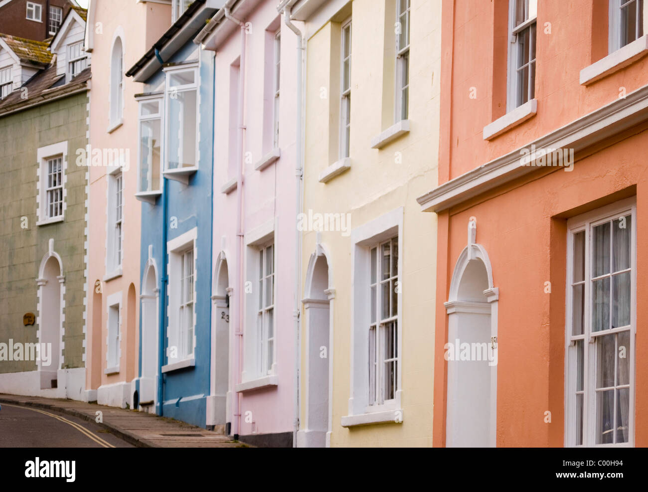 Pastel coloured traditional style houses in resort village of Salcombe ...