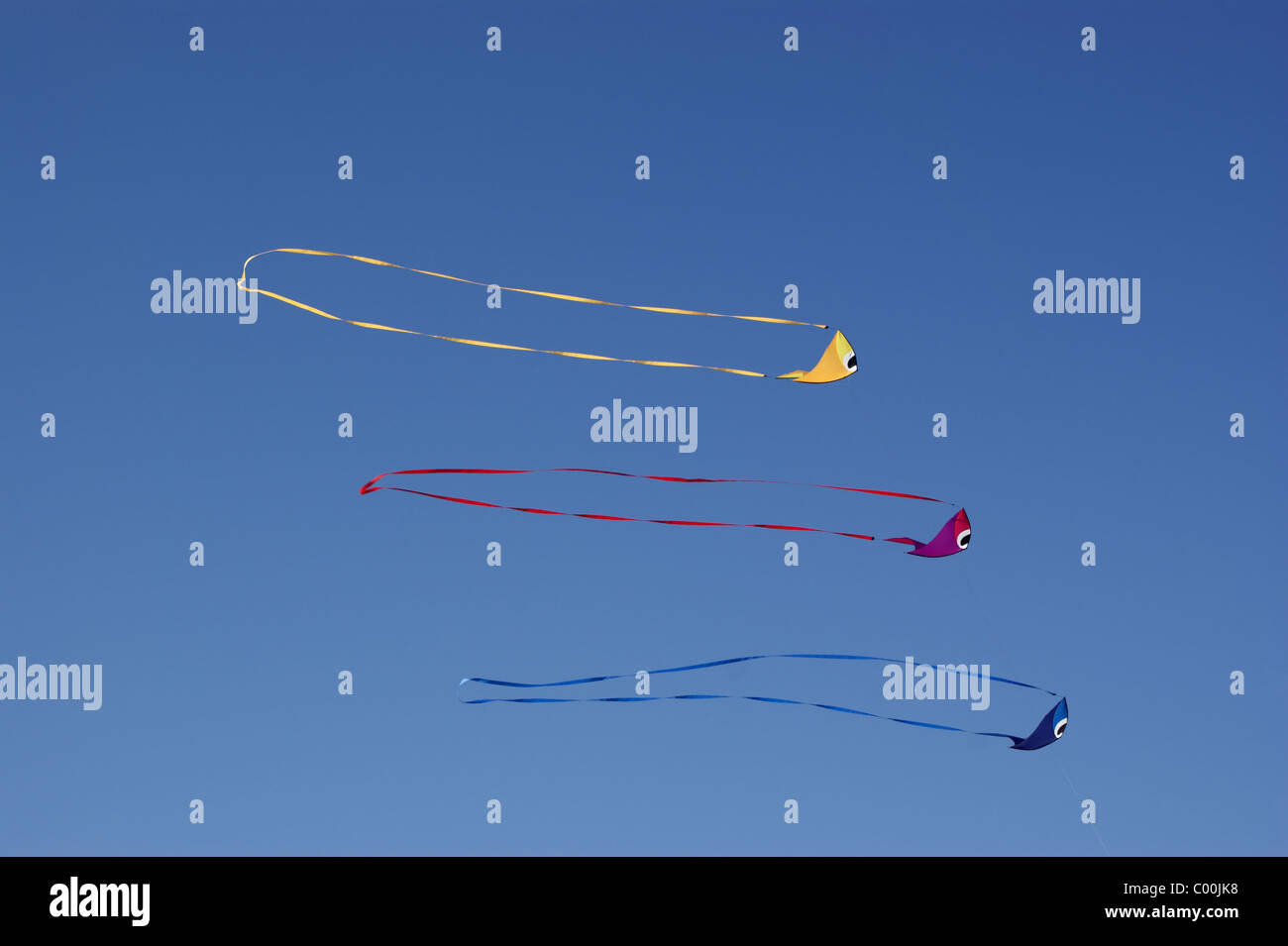 Three fish-shaped kites against a vivid blue sky Stock Photo - Alamy