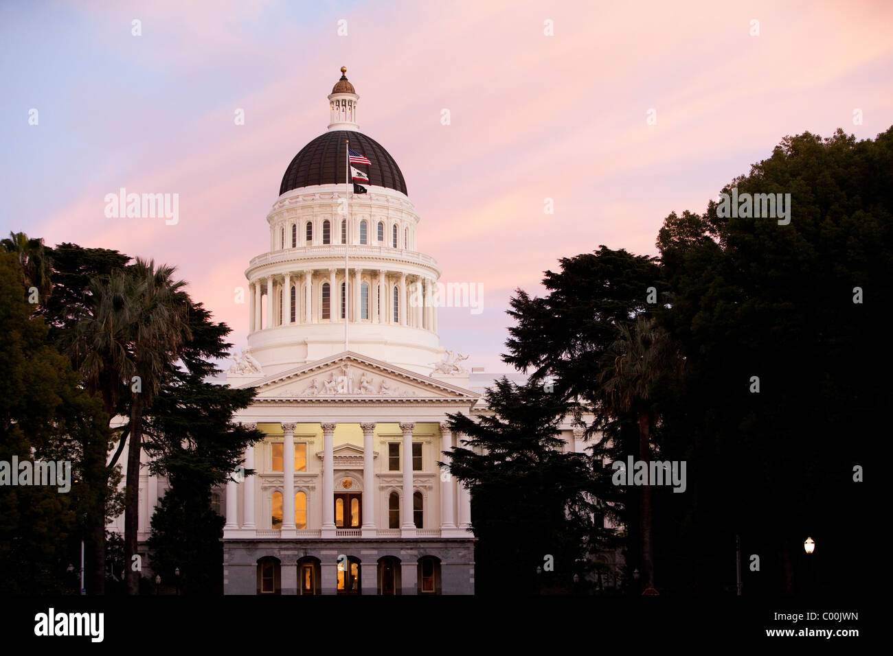 California State Capitol with Palm Trees at Sunset Stock Photo - Alamy