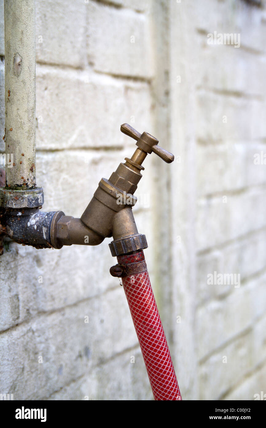 Water tap on wall Stock Photo - Alamy