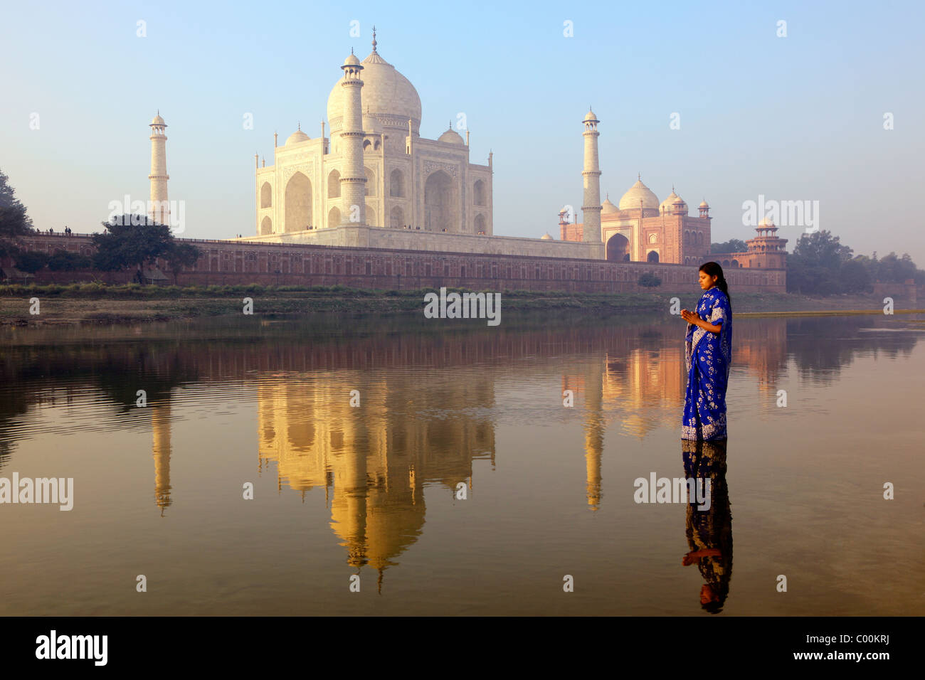 India, Uttar Pradesh, Agra, girl in Sari standing in Yamuna river at ...