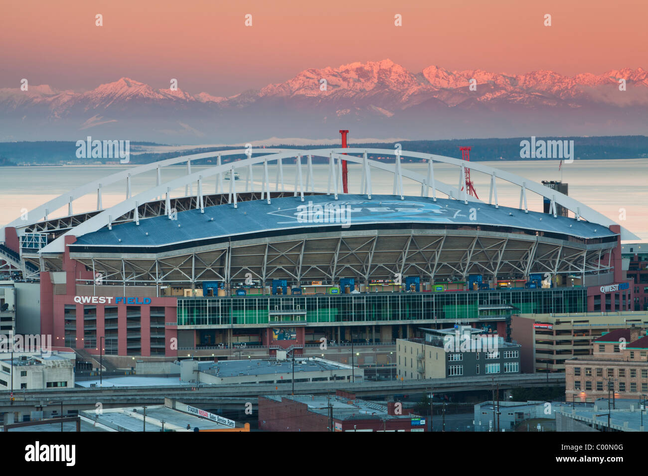 Qwest Field at sunrise as the distant Olympic Mountains are highlighted ...