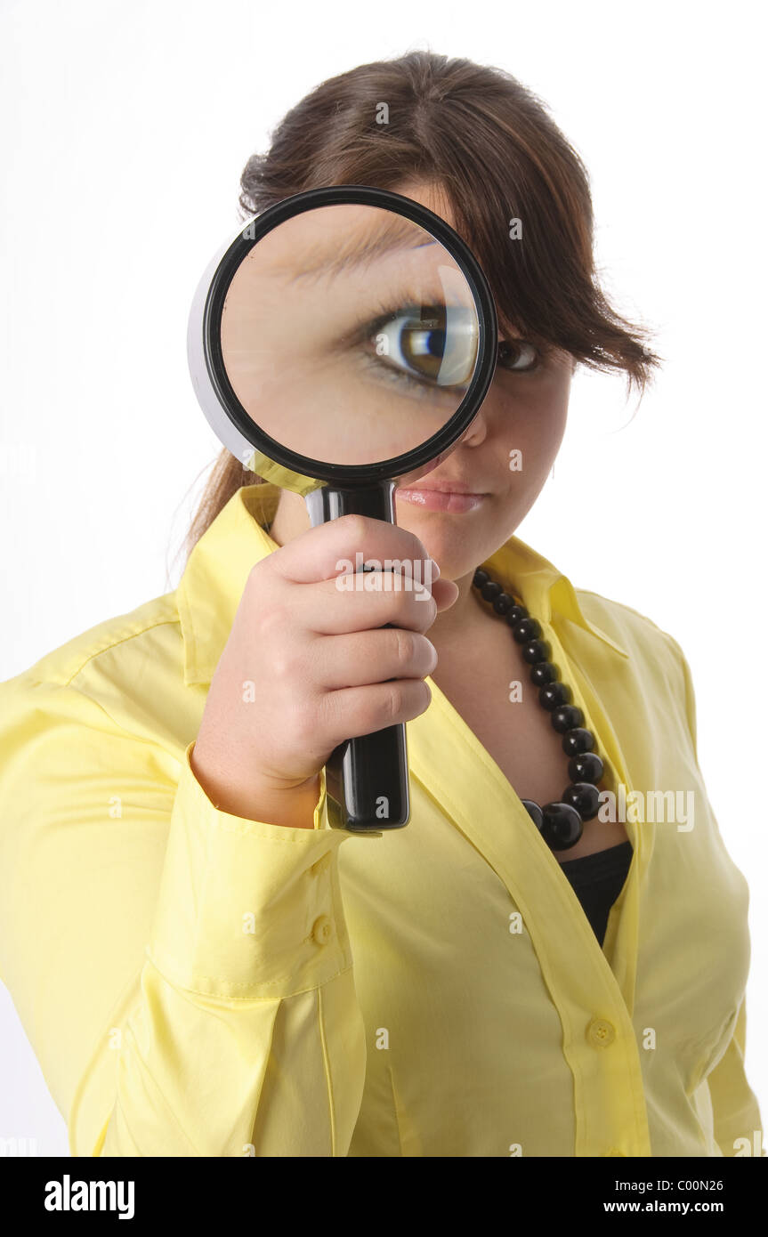 Teenager with magnifier Stock Photo - Alamy