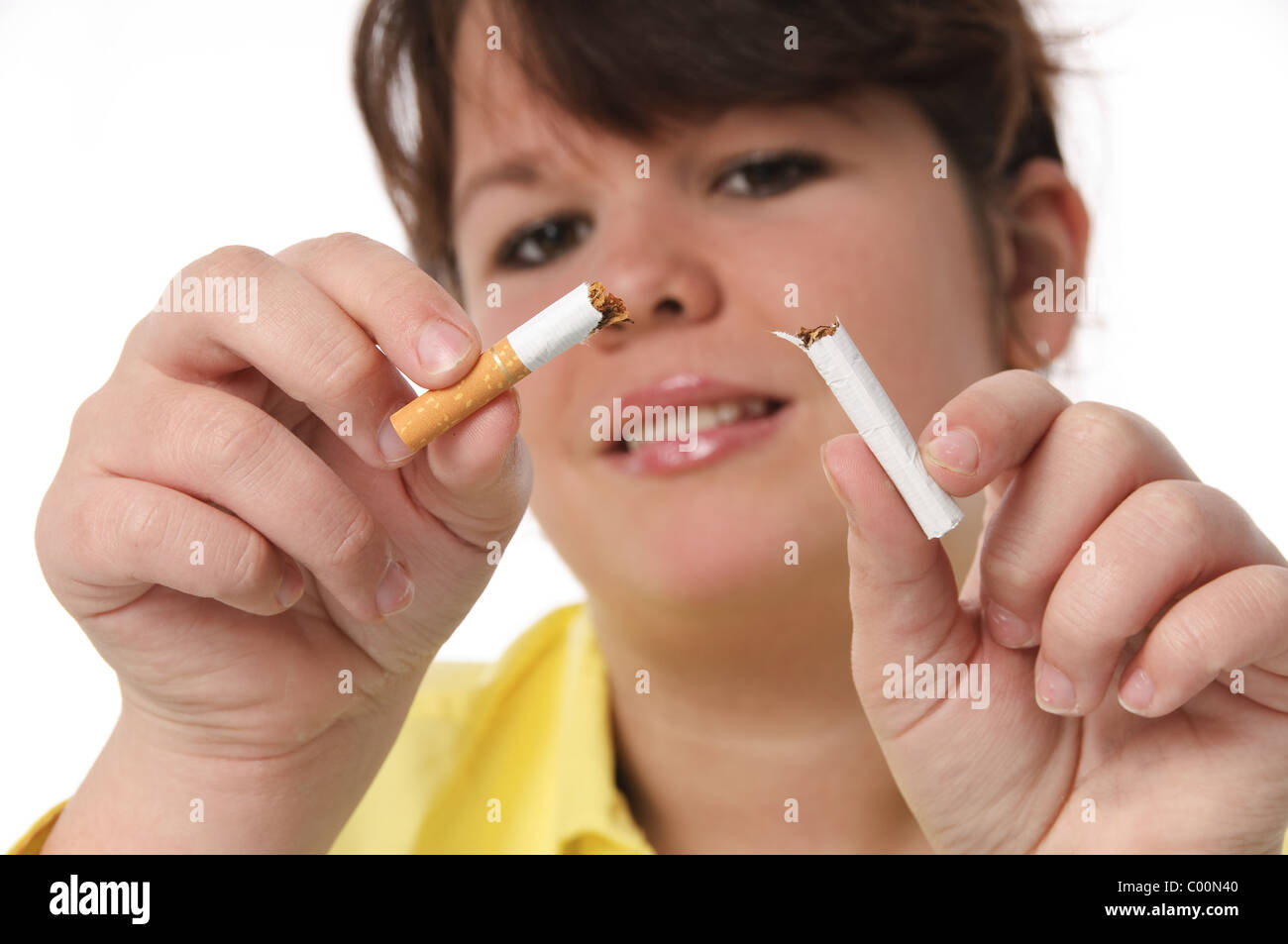 Young people breaking a cigarette Stock Photo - Alamy