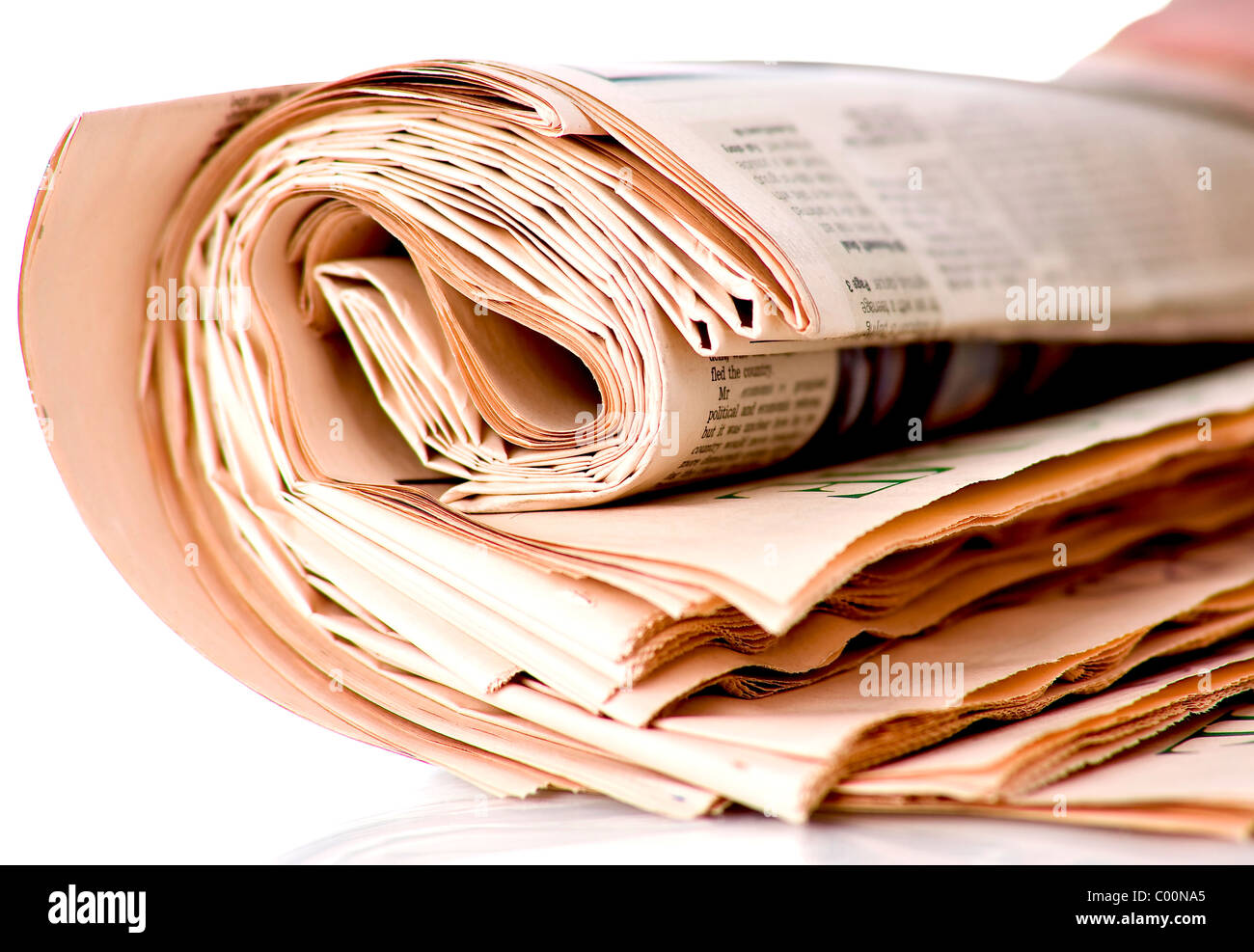 Roll of News papers isolated on white background Stock Photo - Alamy