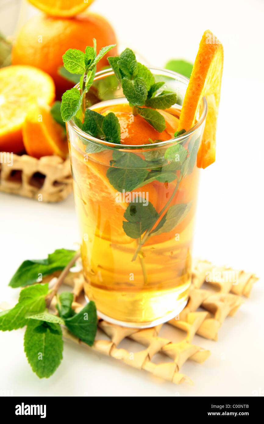 Tea with orange and branches of mint in a glass beaker Stock Photo - Alamy