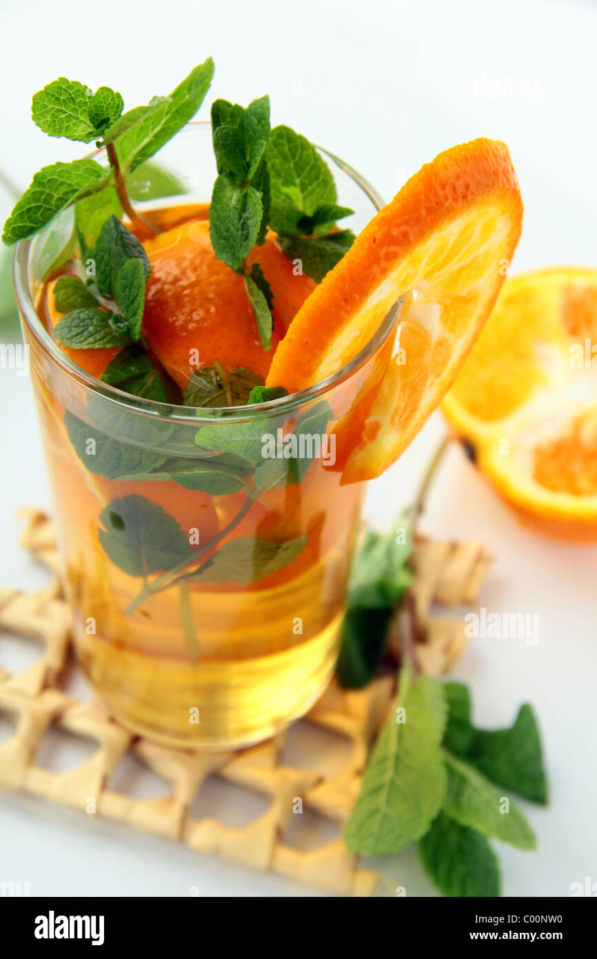 Tea with orange and branches of mint in a glass beaker Stock Photo - Alamy