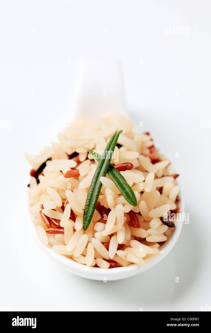 Spoon of cooked mixed rice - studio Stock Photo - Alamy