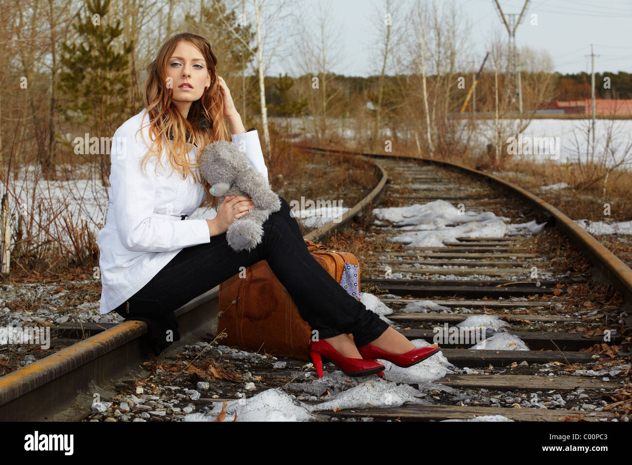 Girl on rail Stock Photo - Alamy