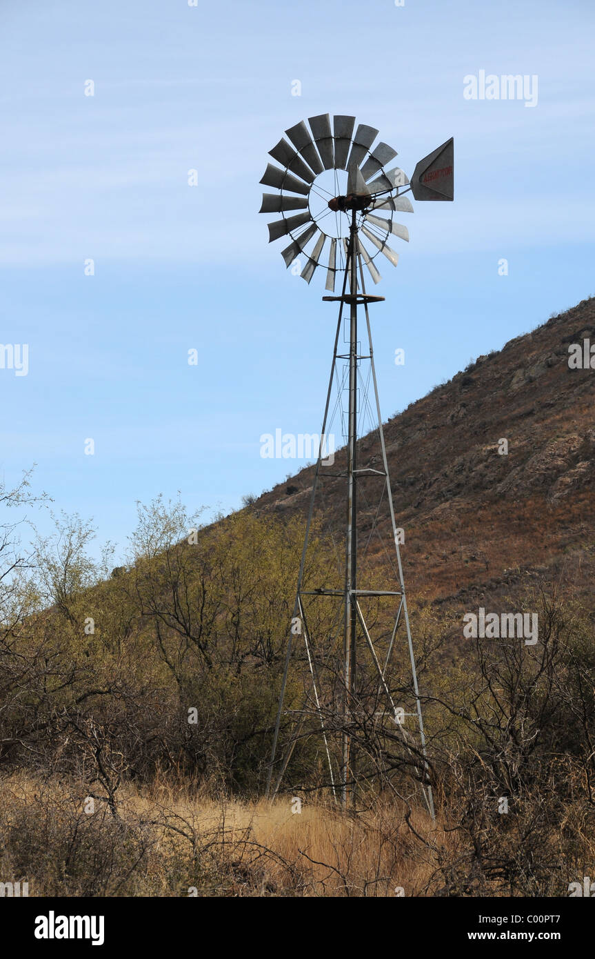 A wind mill pumps water from a well about 20 miles north of Sasabe ...