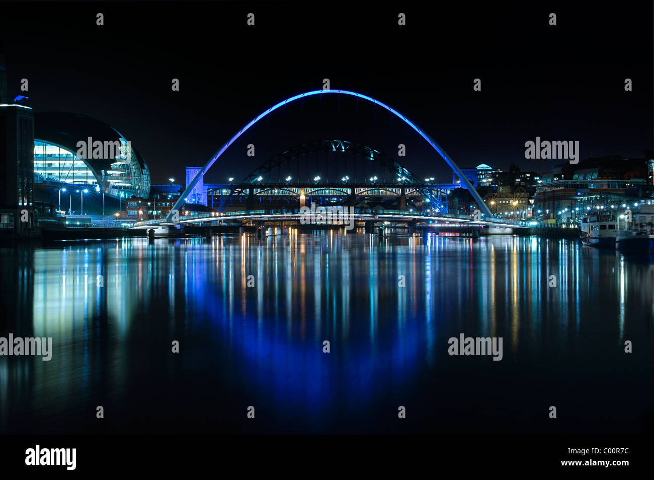 Night-time photograph of the bridges over the River Tyne in Newcastle ...