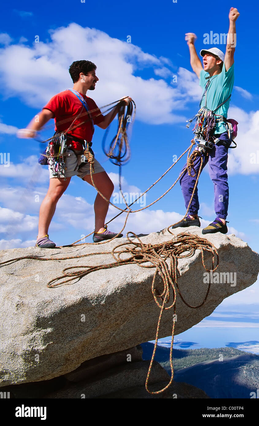 Team of climbers on the summit Stock Photo - Alamy
