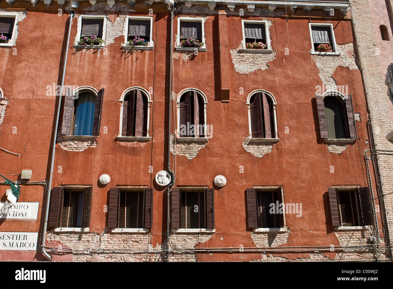 Red house facades in Venice, Italy Stock Photo - Alamy