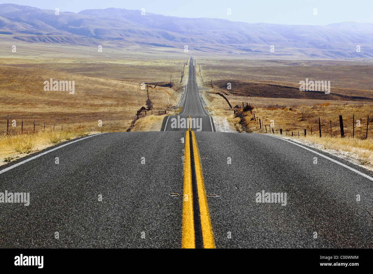 Magnificent American road and fencings Stock Photo - Alamy