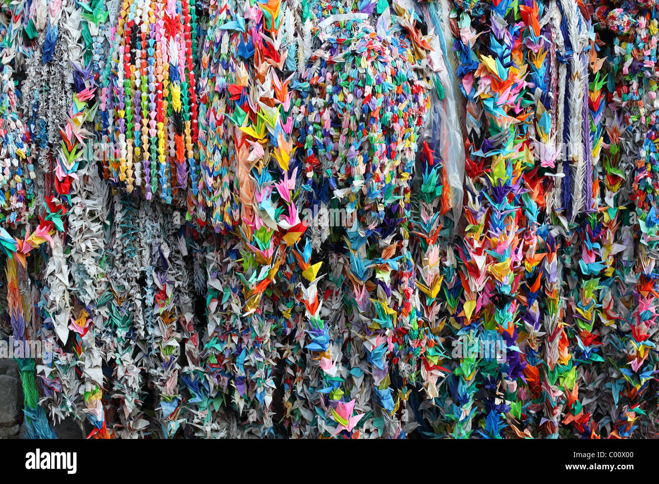Coloured strips of cloth hanging in shrine at Ishite Ji temple, Dogo ...