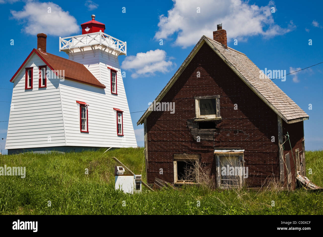 A lighthouse and a shack on Prince Edward Island, Canada Stock Photo ...