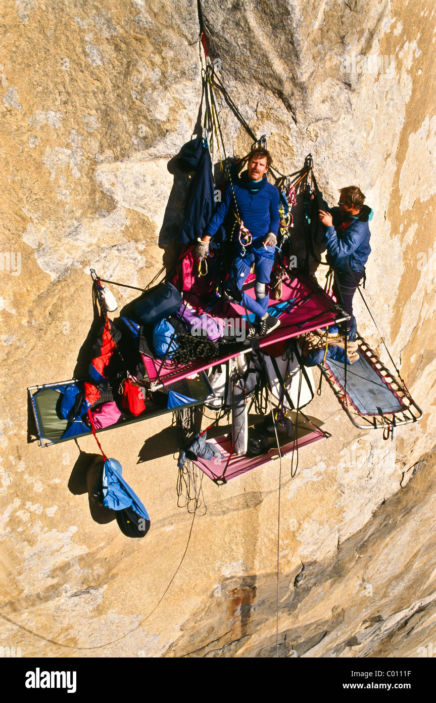 Team of climbers reaching the summit Stock Photo - Alamy
