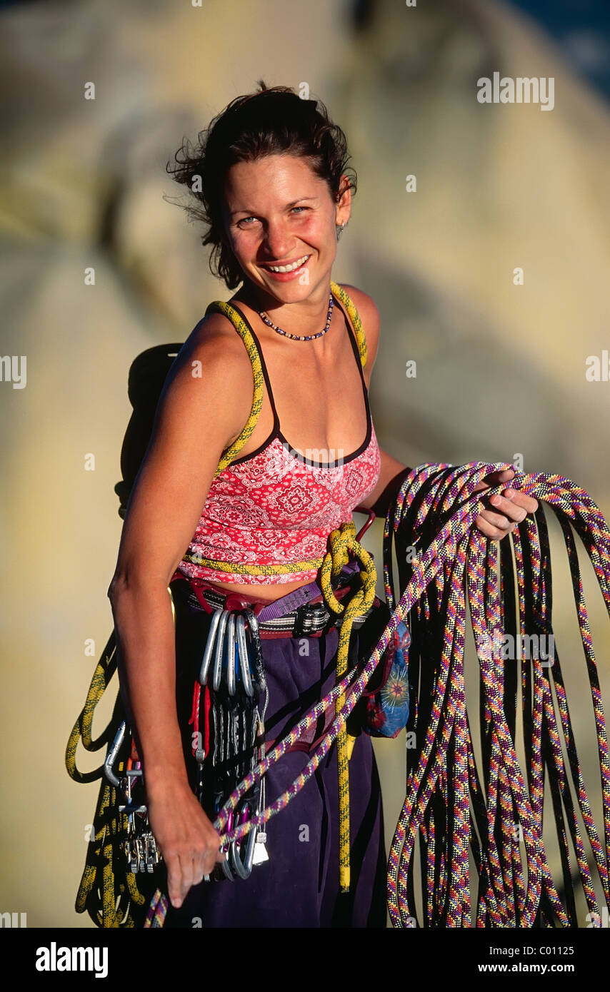 Female climber reaching the summit Stock Photo - Alamy