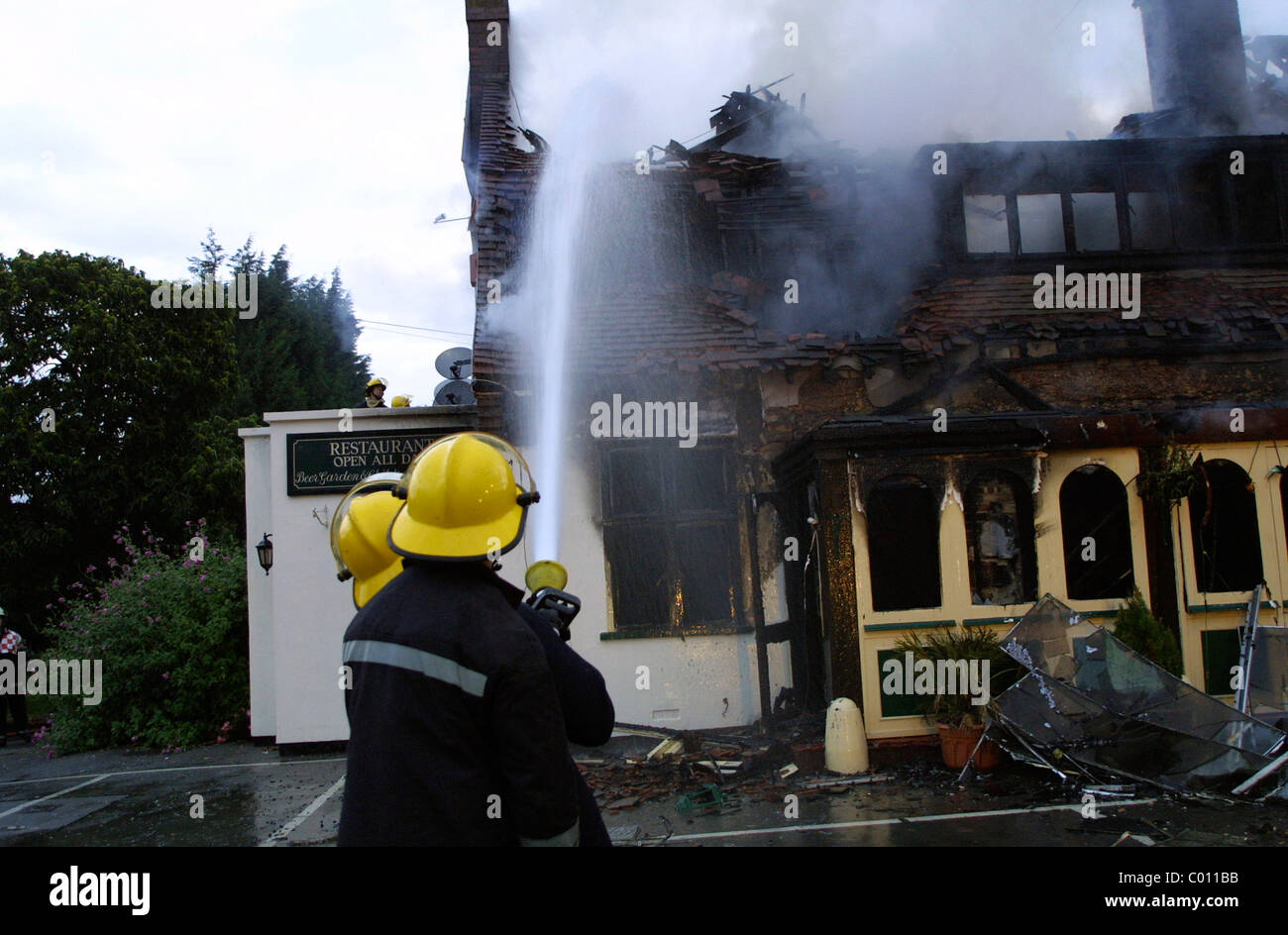 Rescue service firefighters tackling hi-res stock photography and ...