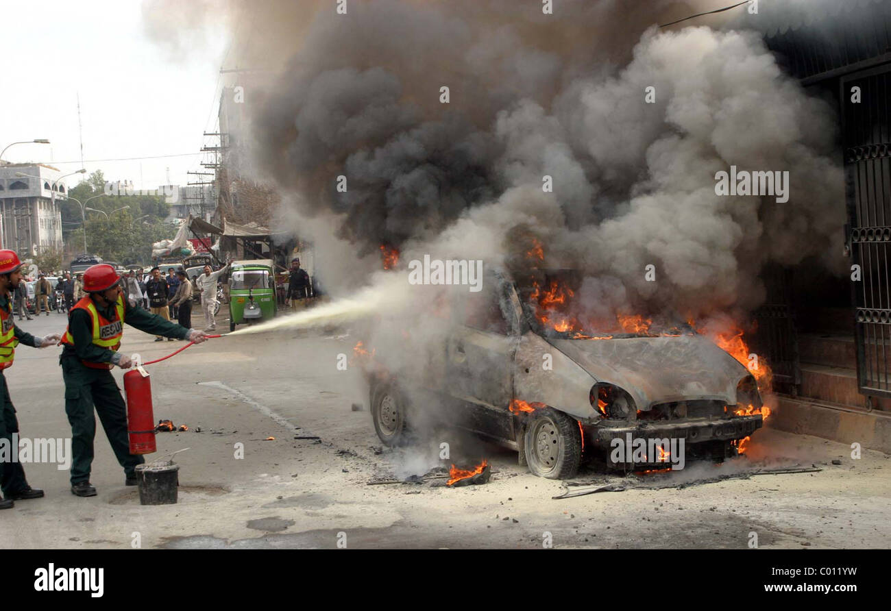 Firefighters extinguish fire on burning vehicle which was caught fire ...
