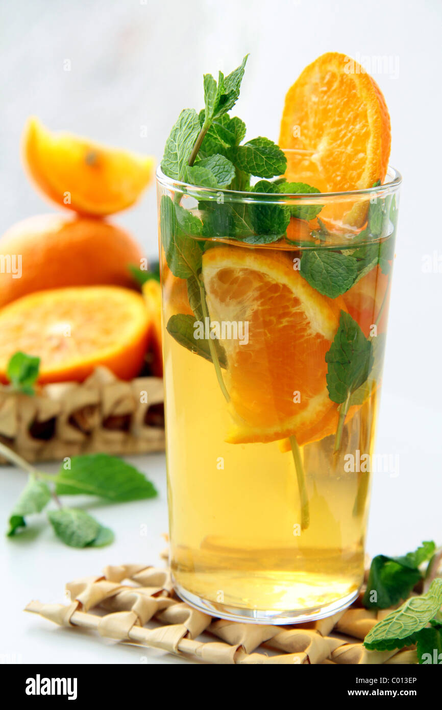 Tea with orange and branches of mint in a glass beaker Stock Photo - Alamy