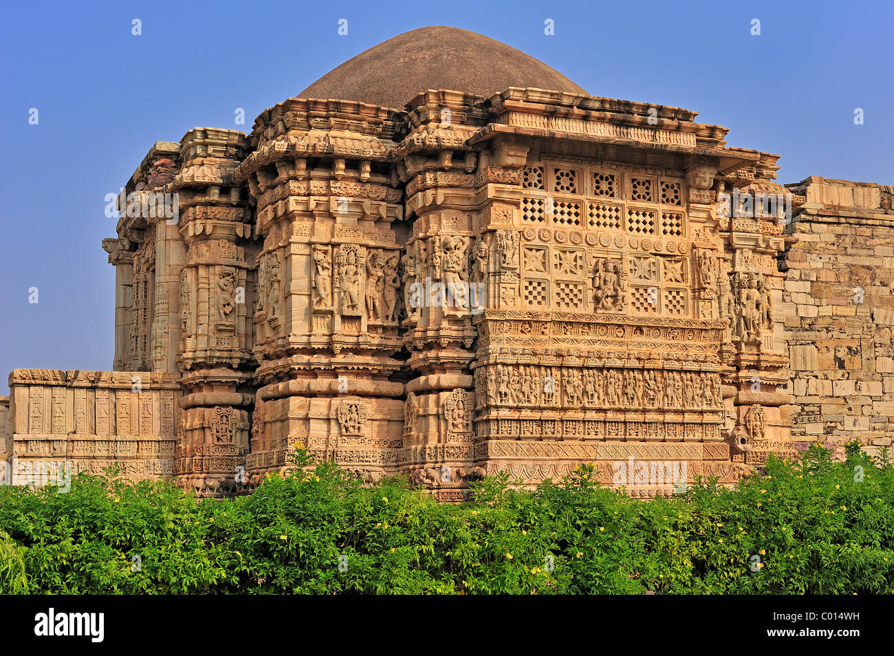 Old Hindu temple with domed roof and intricate carvings on the outer ...