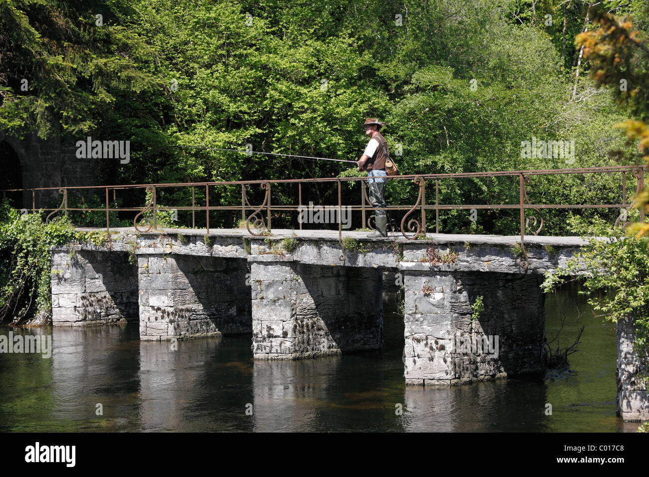 Angler on a bridge, River Cong, Cong, County Mayo and Galway, Connacht ...