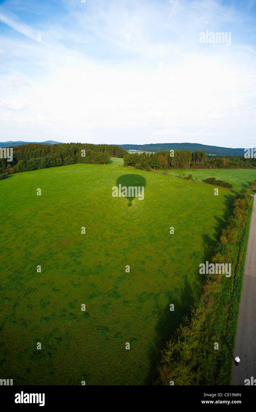 Balloon ride, hot air balloon throwing shadow Stock Photo - Alamy