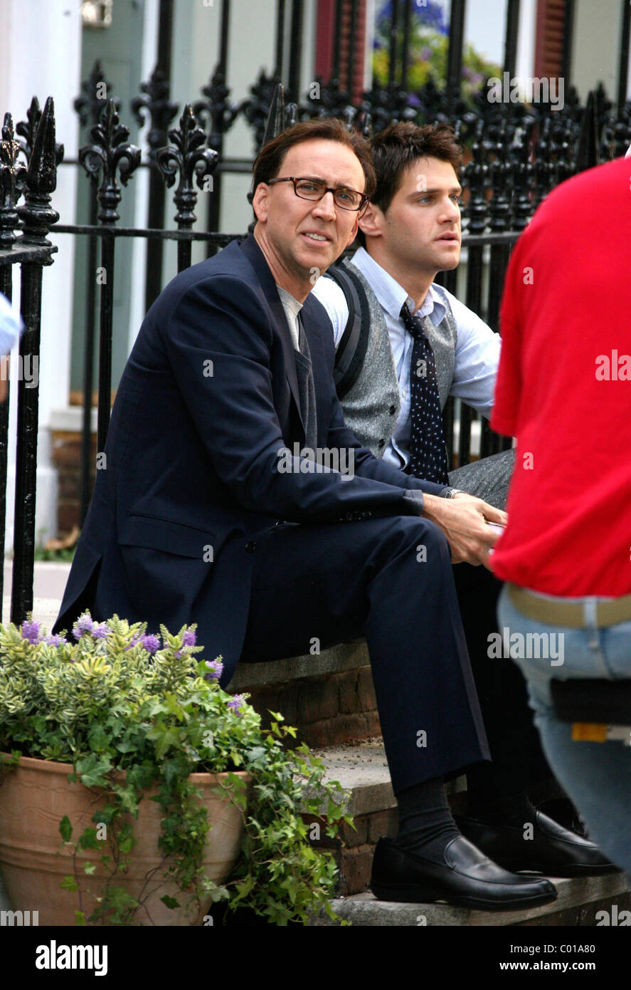 Nicolas Cage reading a book on set whilst on a break from filming on ...