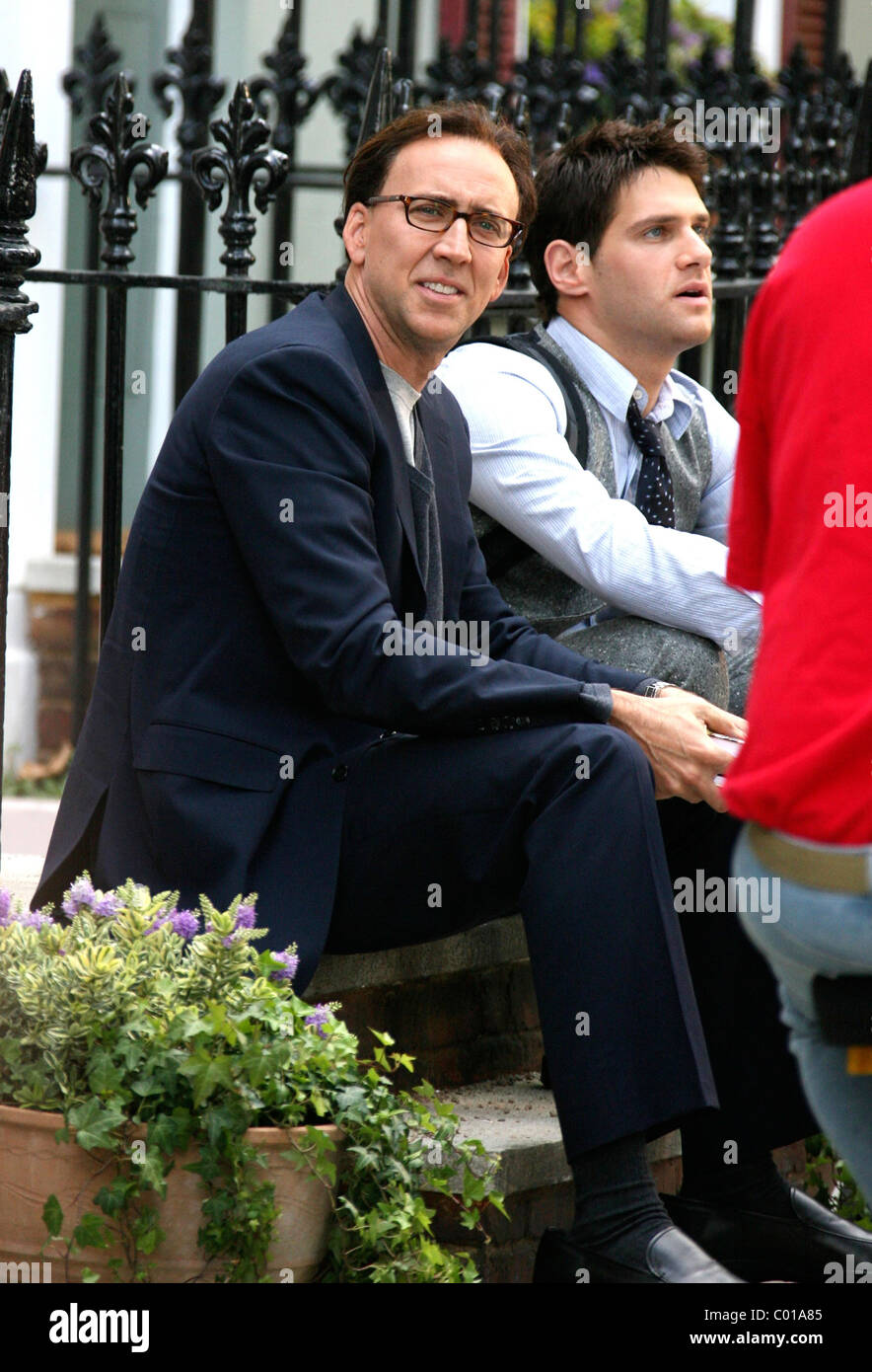 Nicolas Cage reading a book on set whilst on a break from filming on ...
