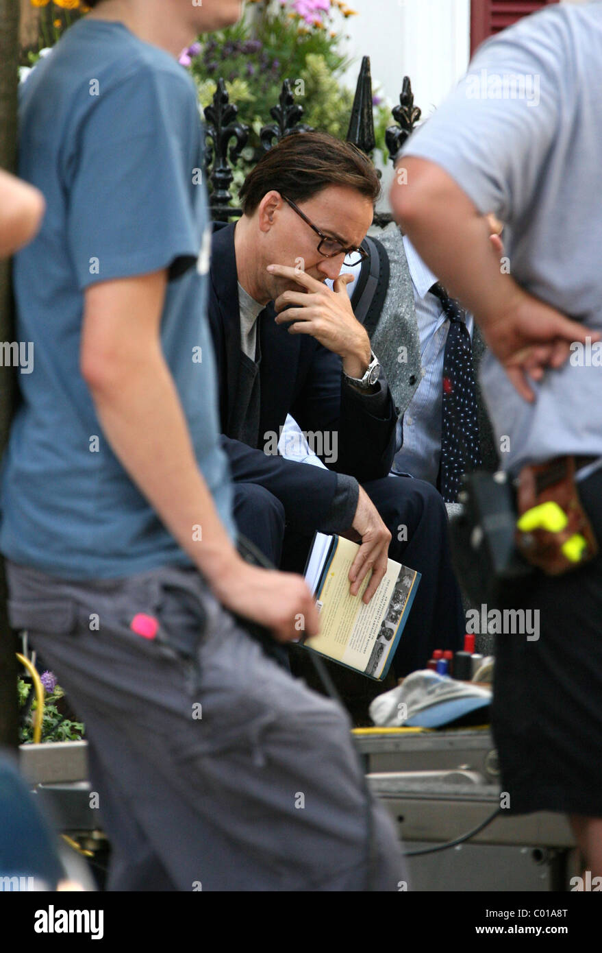 Nicolas Cage reading a book on set whilst on a break from filming on ...