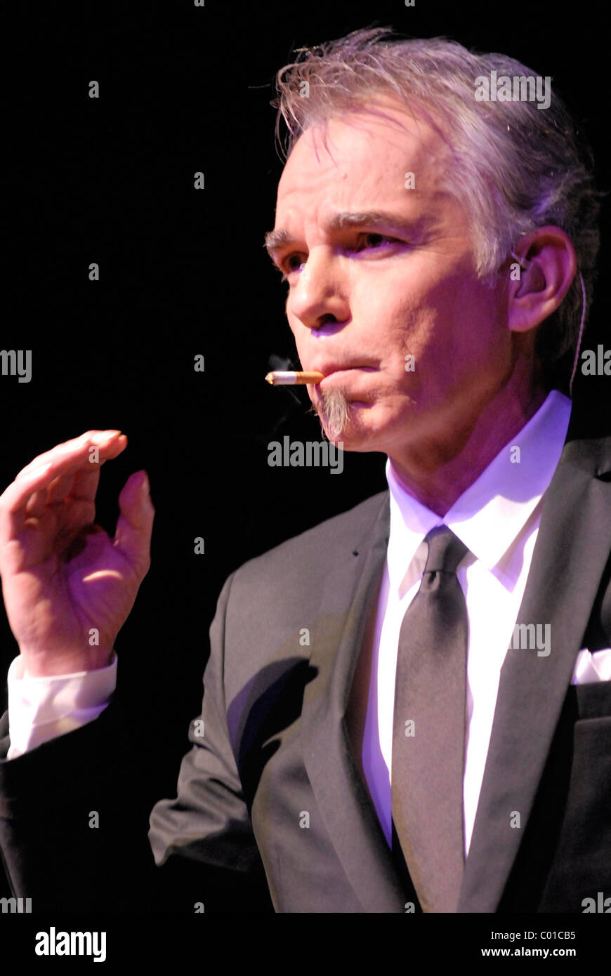 Billy Bob Thornton smoking on stage as he performs with the Boxmasters ...