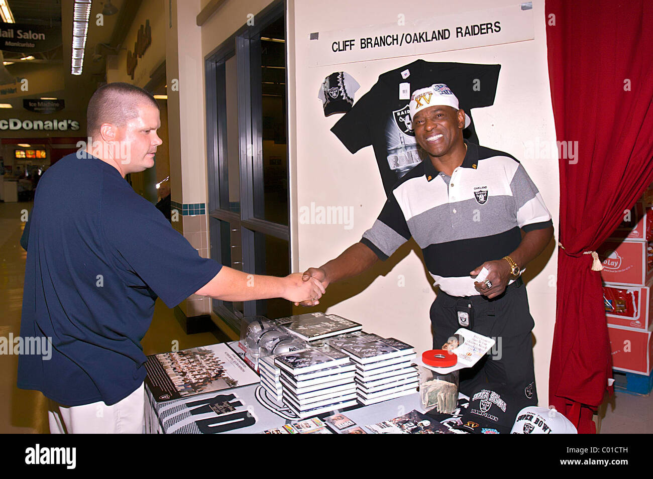 NFL Legend Cliff Branch signs memorabilia for fans at Wal-Mart Las ...