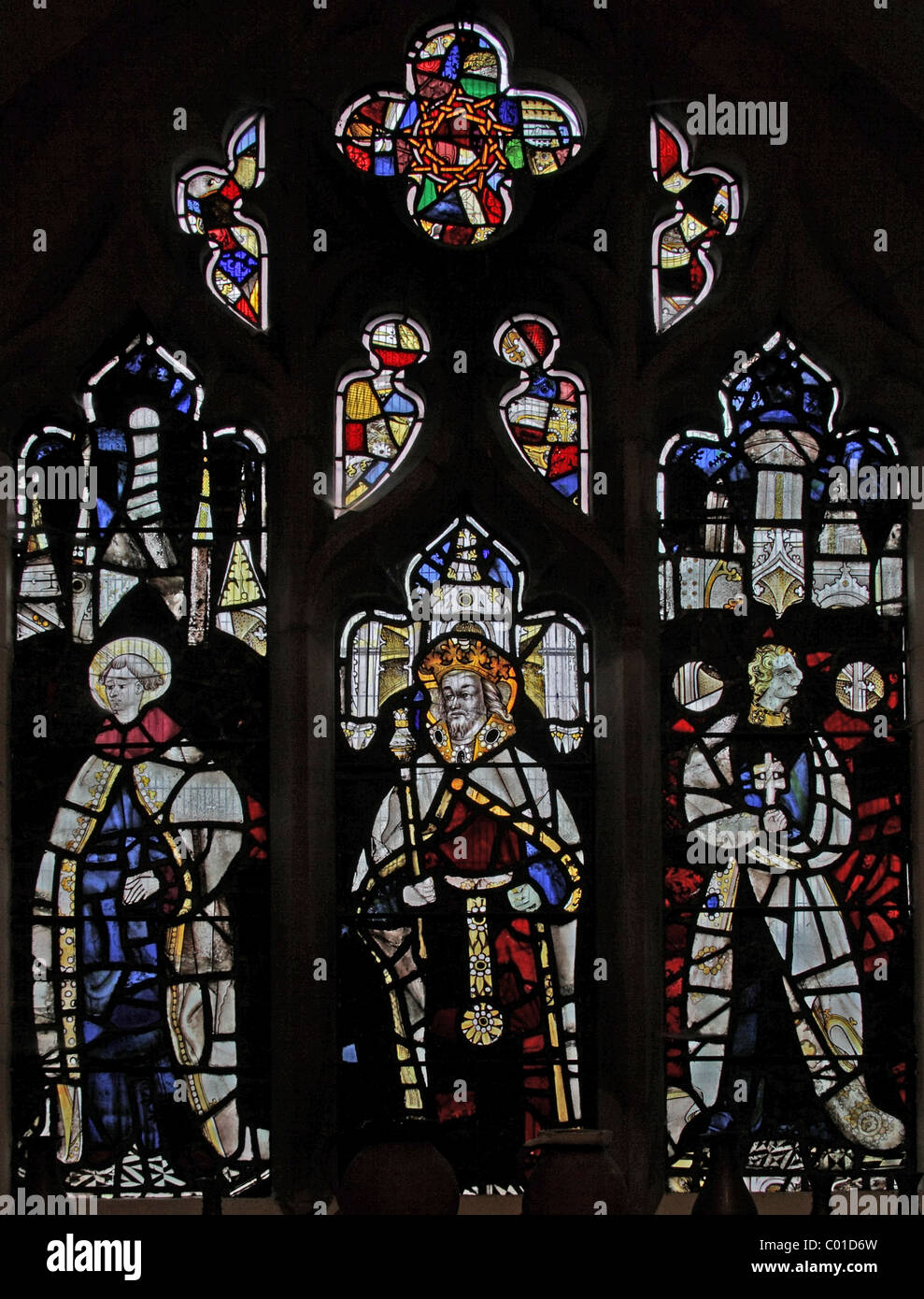 A 16th century stained glass window depicting a king, a monk and a ...