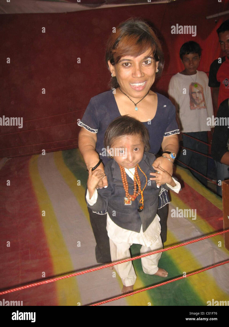 TINY PEOPLE Twenty six-year-old Manju Ghimire sits on top of a stage at ...