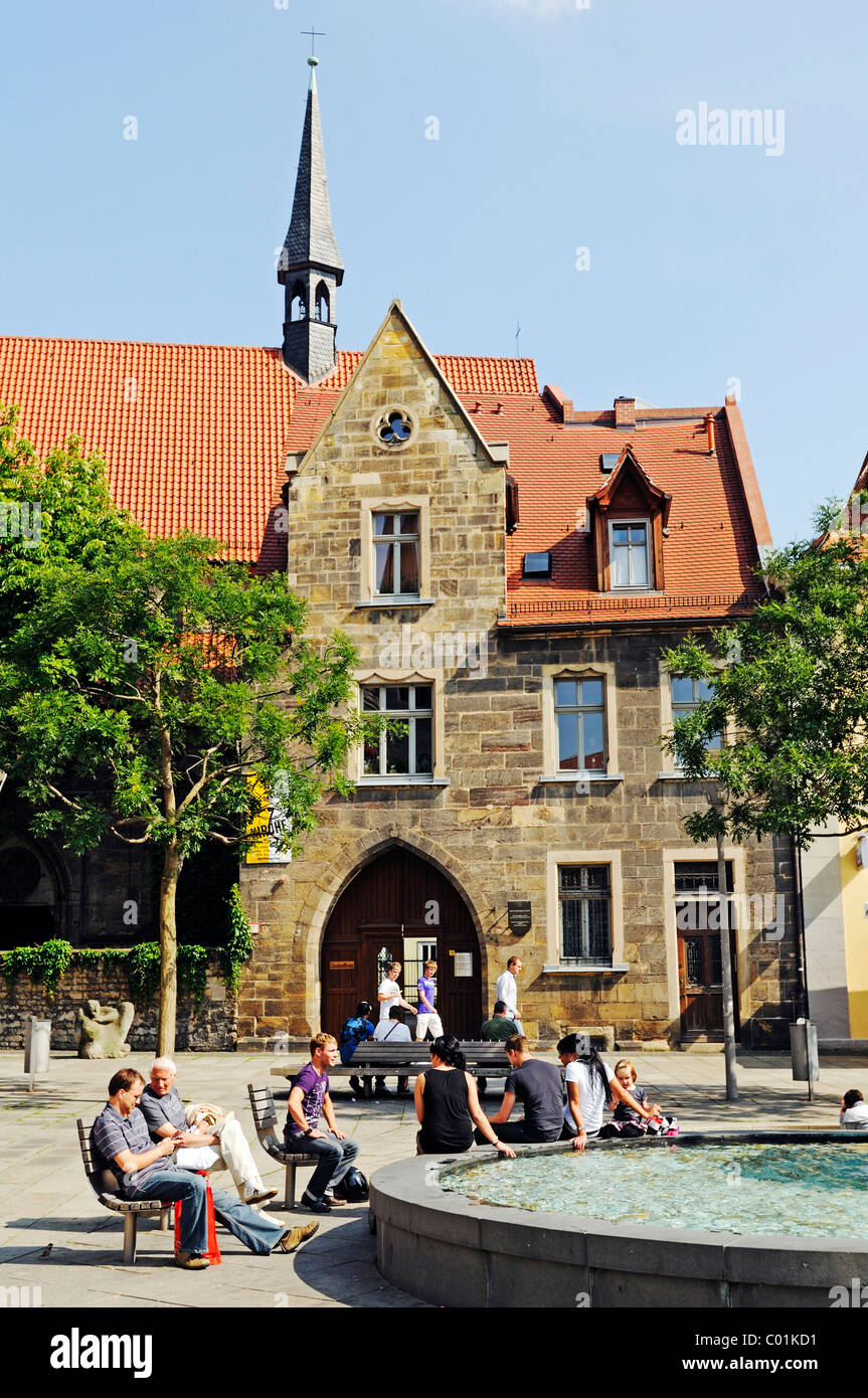 People sitting at a fountain on Anger, Erfurt, Thuringia, Germany ...